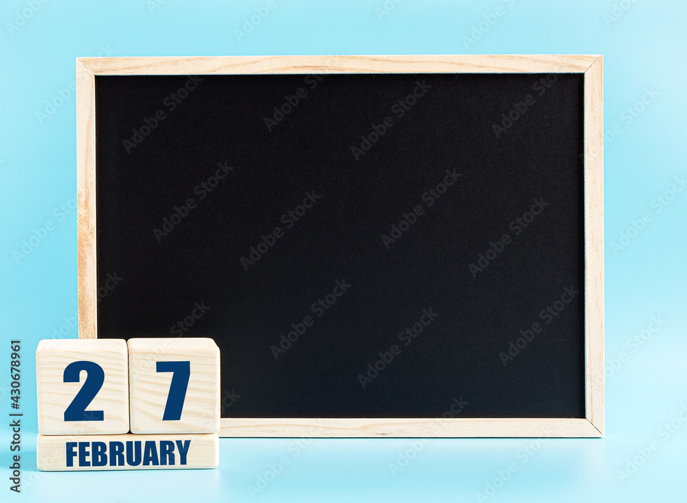 February 27. Day 27 of month, Cube calendar with date, empty frame on ...