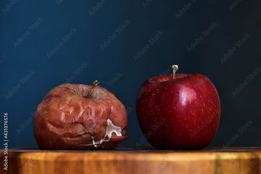 A Rotten and a Fresh Red Apple Next to Each Other. Good vs Bad ...