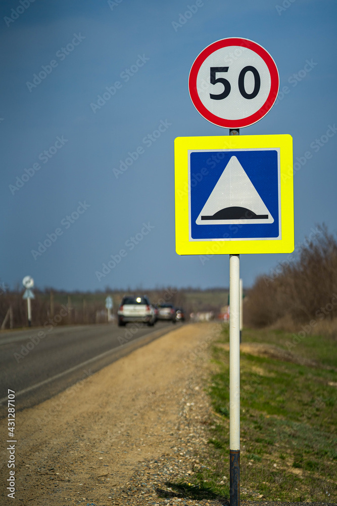 road sign for roughness on the road. close up shot. road sign speed ...