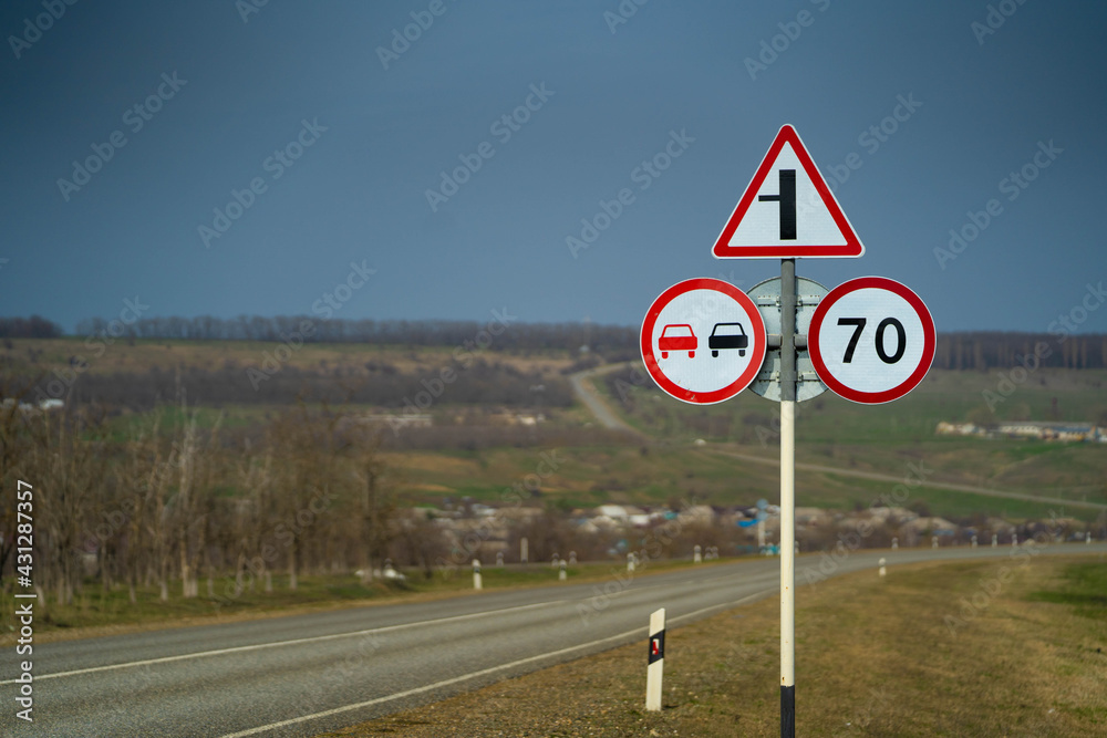 road sign overtaking is prohibited. road sign speed limit 70 km h. road ...