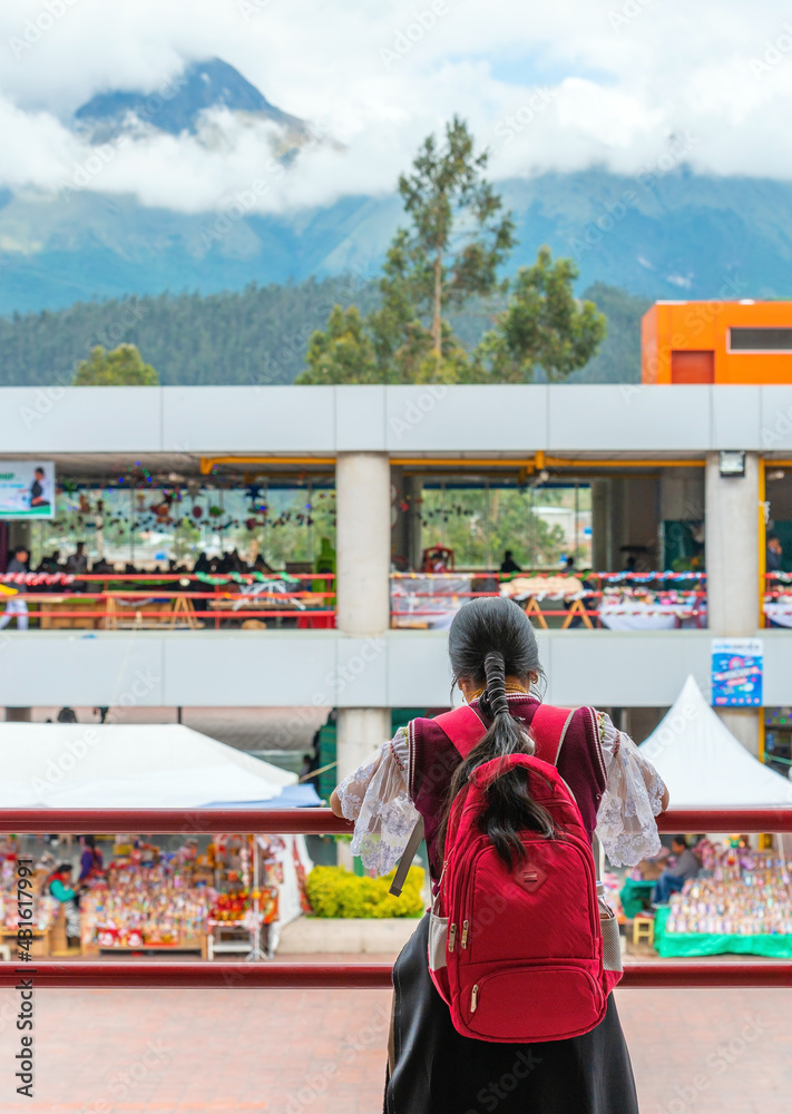 Young indigenous Otavalo woman with school backpack and traditional ...