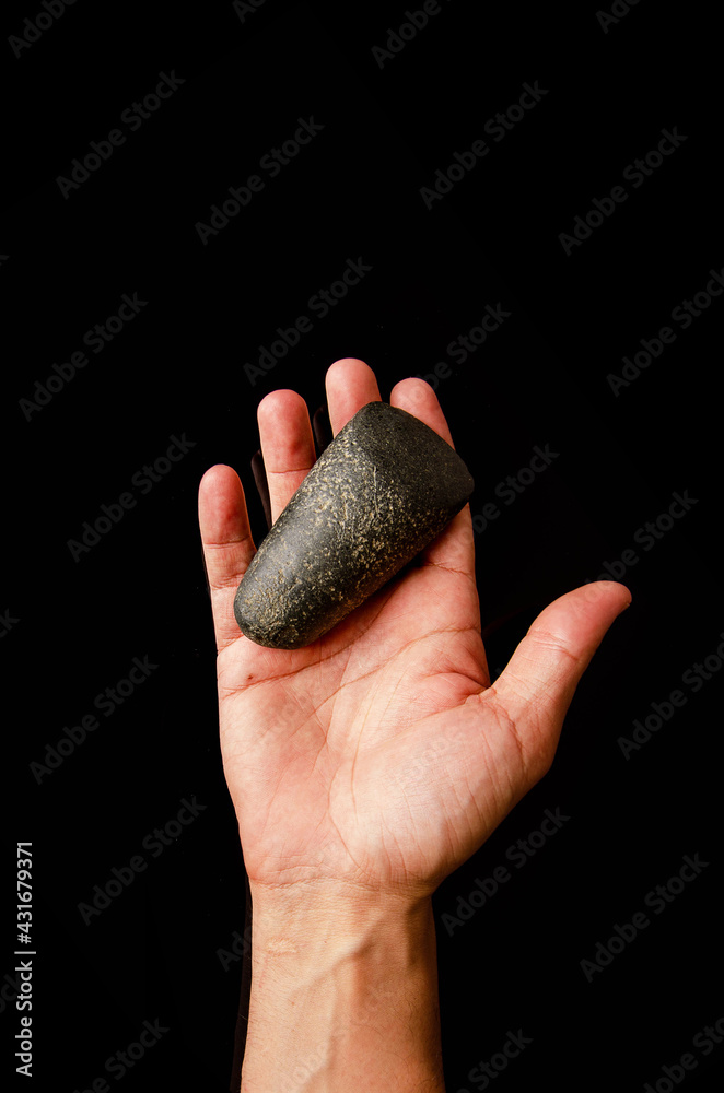 Foto Neolithic stone age man holds a bush hammered ax. From the ...