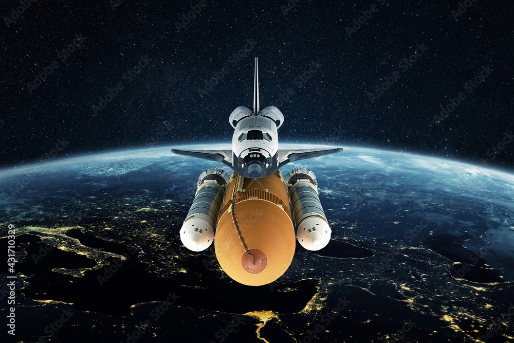 Space shuttle flies over night planet earth with city lights in space ...