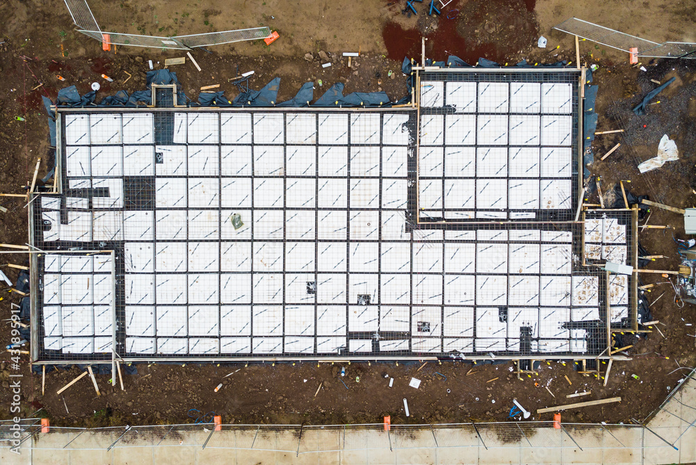Aerial view of a house in the early stages of construction, preparation ...
