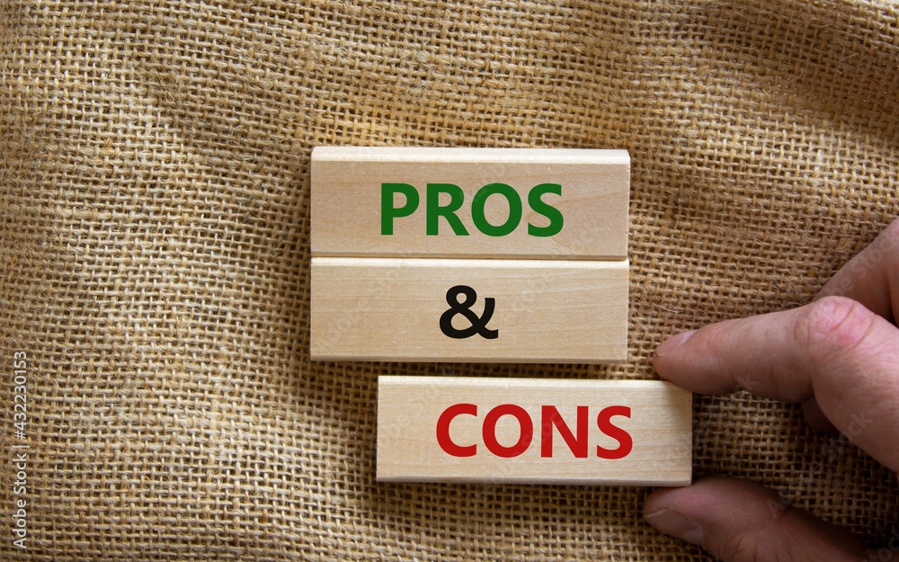 Pros and cons symbol. Wooden blocks with words 'Pros and cons ...