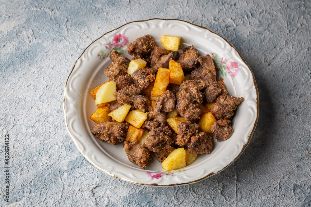 Liver pan (Albanian liver) Turkish traditional food. Liver over rice ...