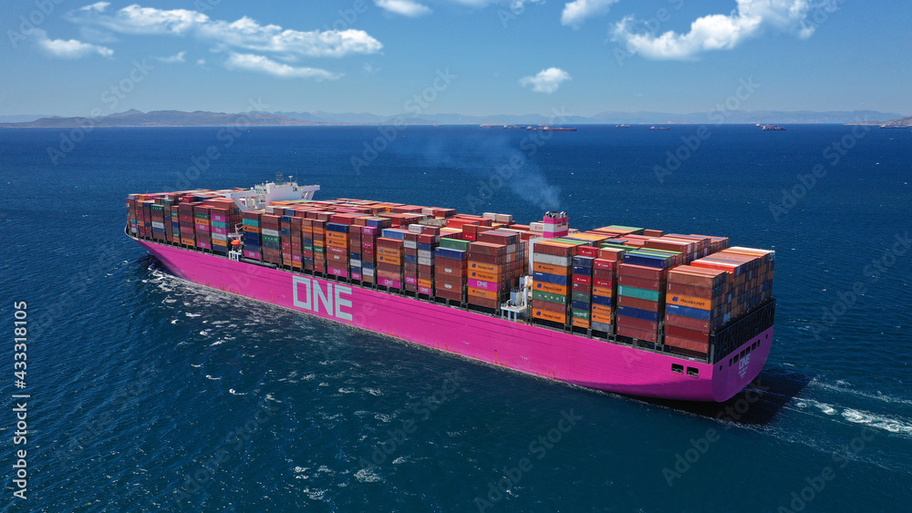 Aerial drone photo of ONE truck size container cargo vessel cruising in ...