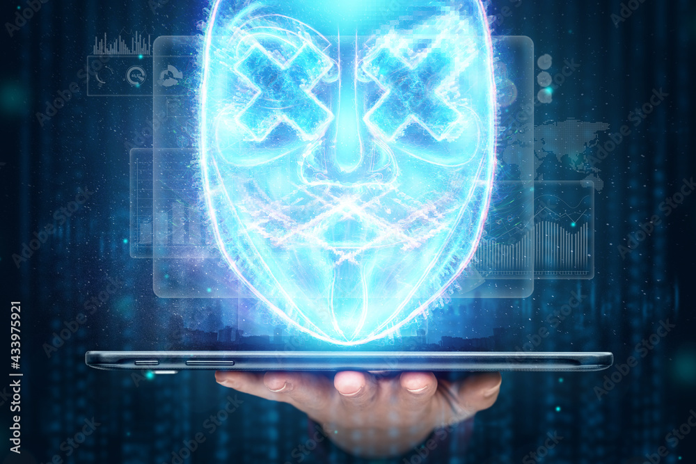 Hologram digital mask of a hacker on a tablet, hacking electronic devices, stealing personal ...