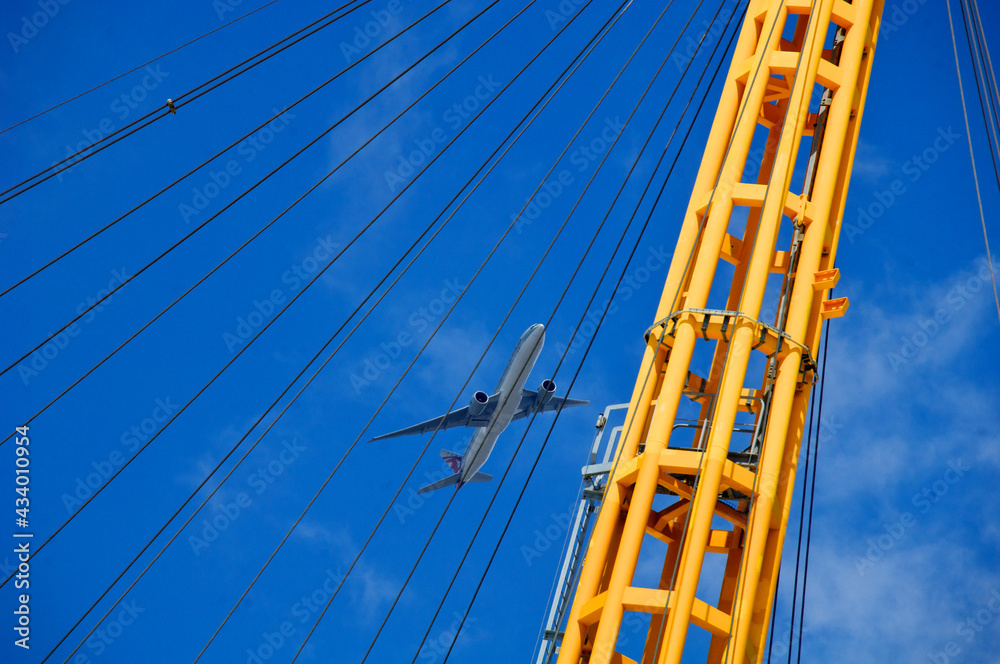 Closeup of yellow mast and support wires. The Millennium Dome features ...