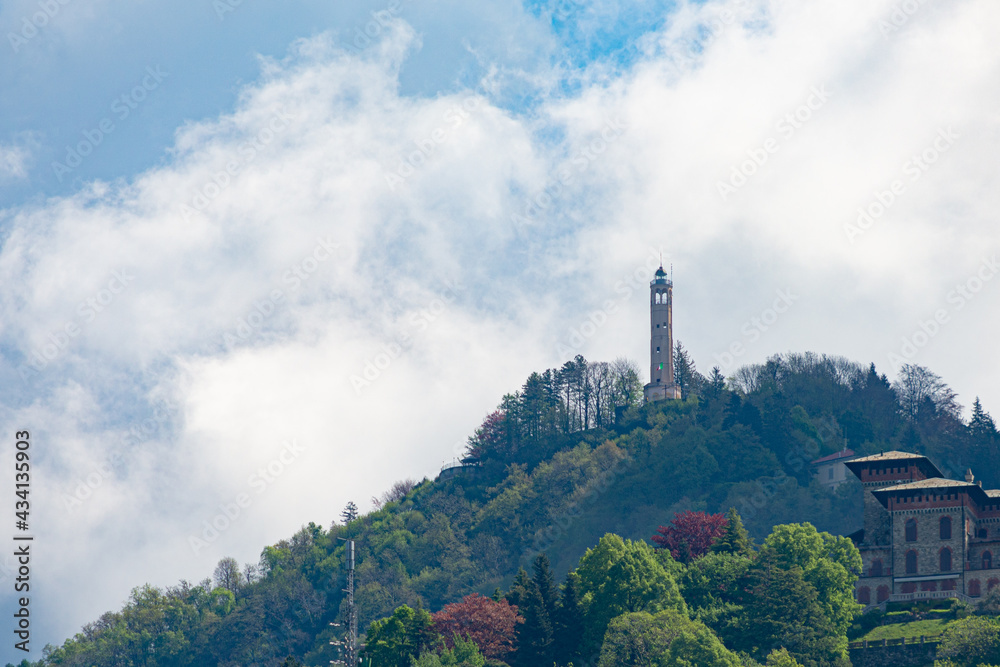 The famous lighthouse on a hill in front of Como, Italy, located in a ...