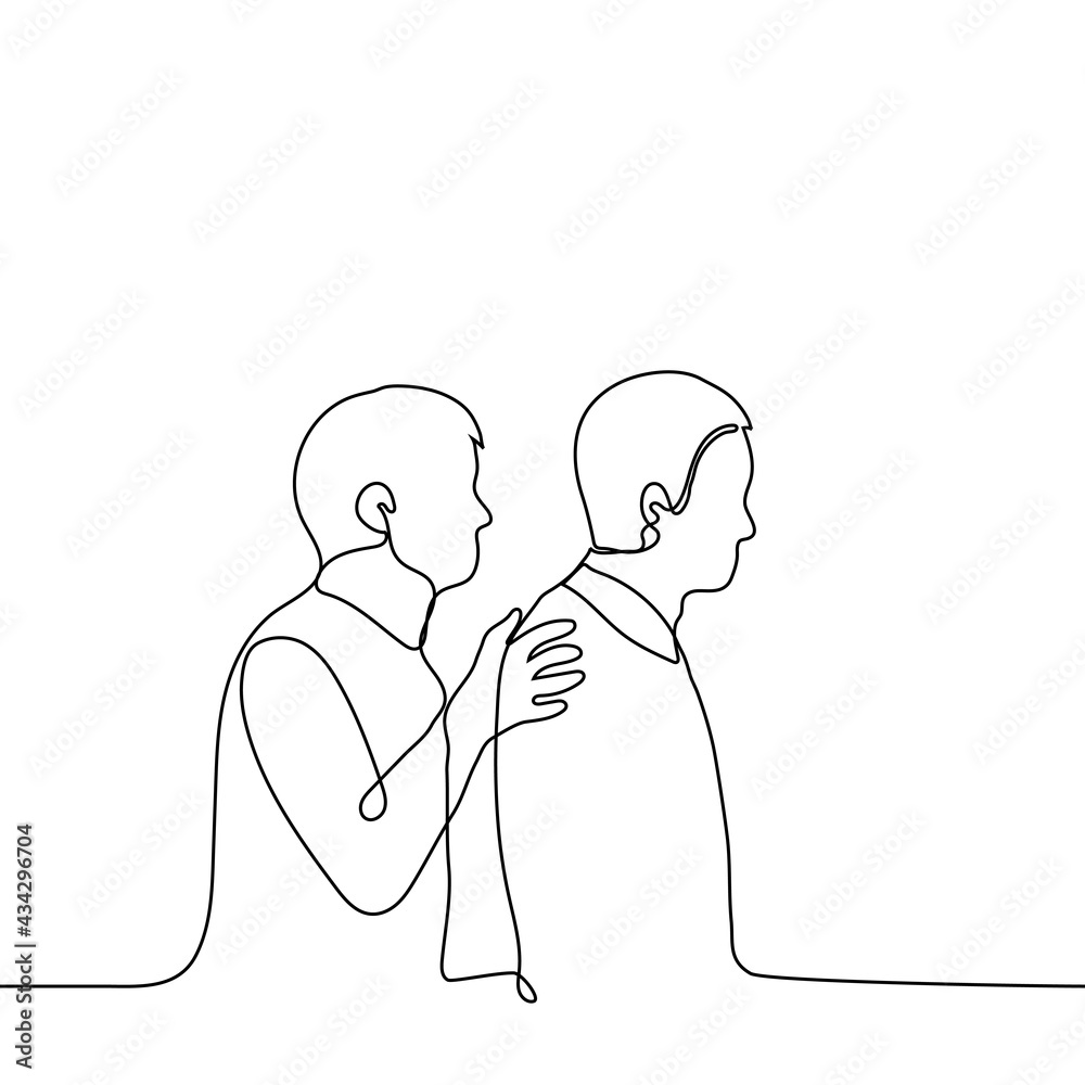 man pushes a standing man forward while holding his shoulders - one ...