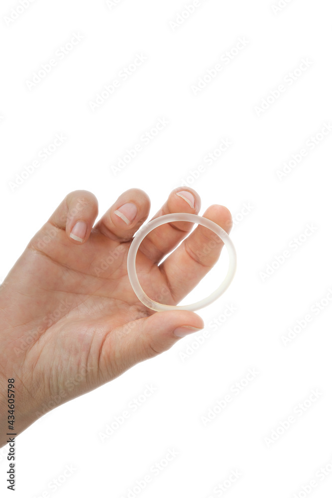 Birth control ,hormone, contraception ring in a womans hand isolated on ...