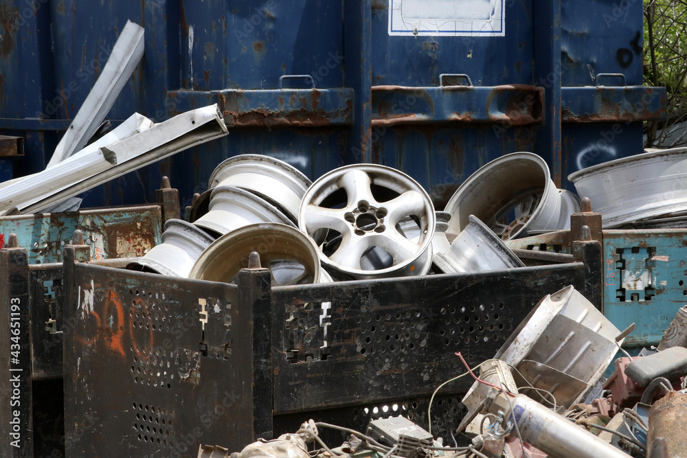 Junkyard featuring recycling of metal to make new steel. Moving cars ...