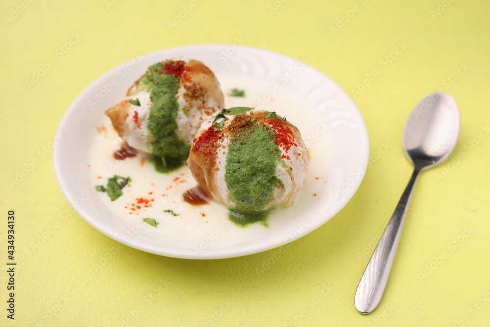 Indian street food Dahi vada Dahi Bhalla with green chutney, tamarind ...