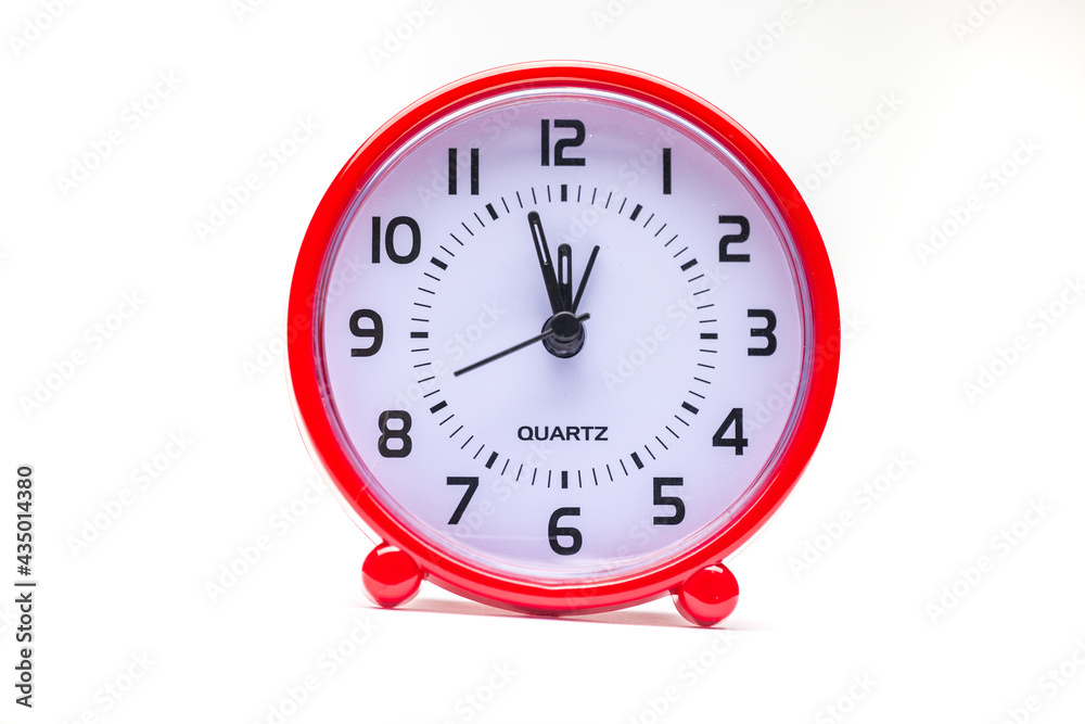 Small red alarm clock show the running time. A modern clock with red ...