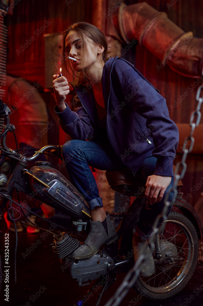 Drug addict woman smokes a cigarette Stock Photo | Adobe Stock