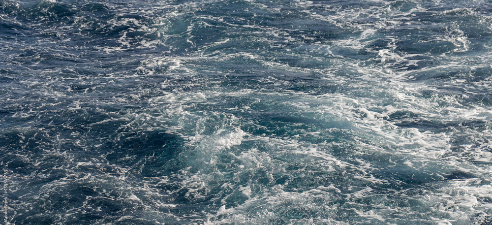 Turbulent flow of a boat wake. Sea wave. The yacht sails, leaving ...