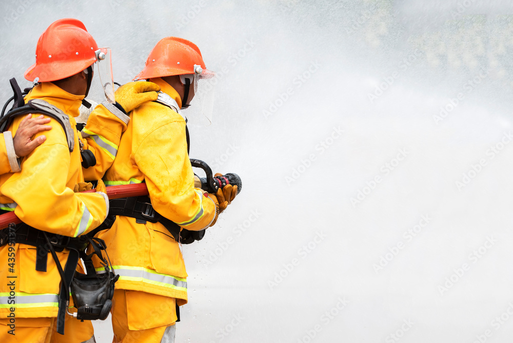 Firefighters train firefighters to use water and fire extinguishers to ...