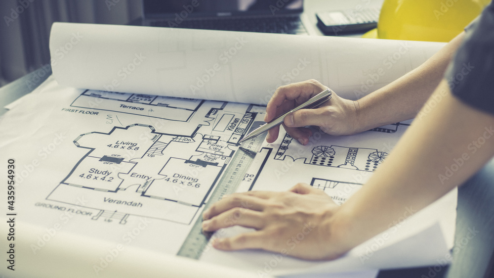 Engineer and Architect concept, Man uses a ruler to measure the floor ...