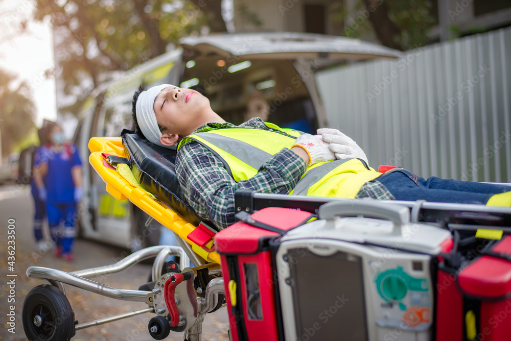 Male patient unconscious / broken head Lying in an ambulance stretcher ...