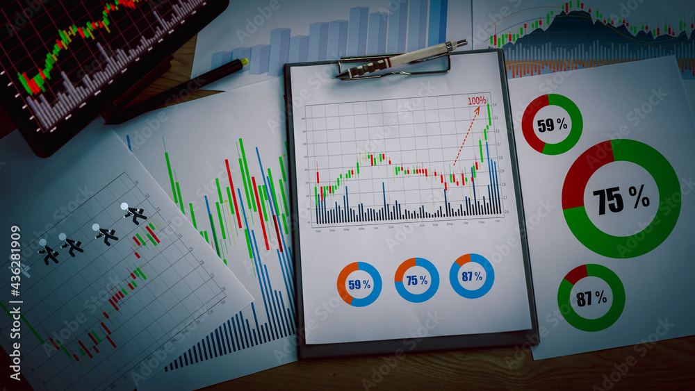 Preparing report. Green and red graphs and charts. Business reports and ...