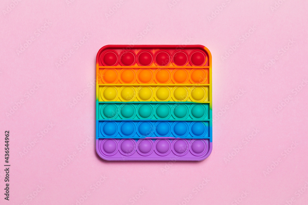 Push Bubble Fidget Toy Pop It on pastel pink background. Trendy rainbow ...