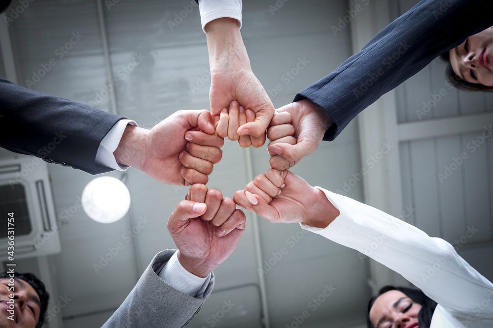 Foto de Stock Businessman and woman putting hands fist join together ...