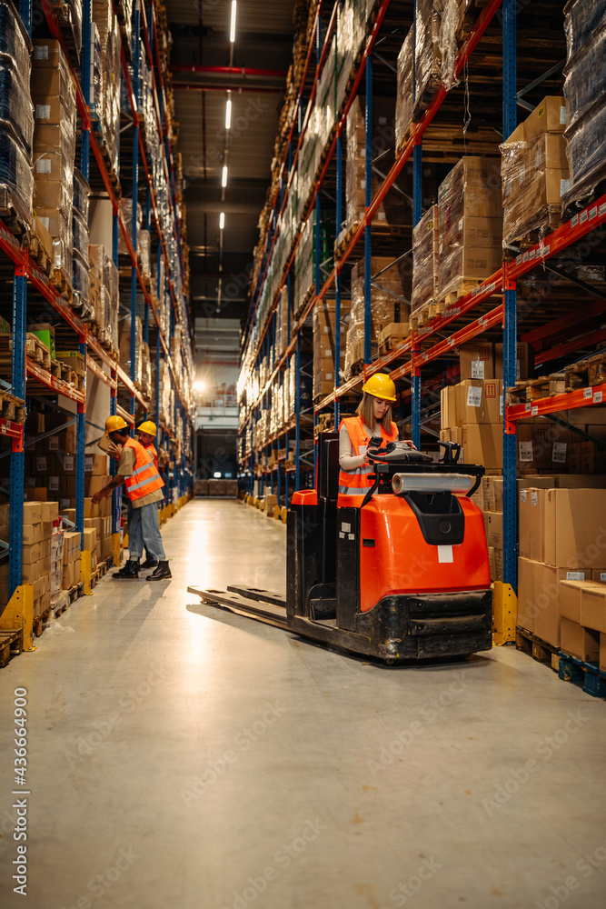 Warehouse workers at work Stock Photo | Adobe Stock