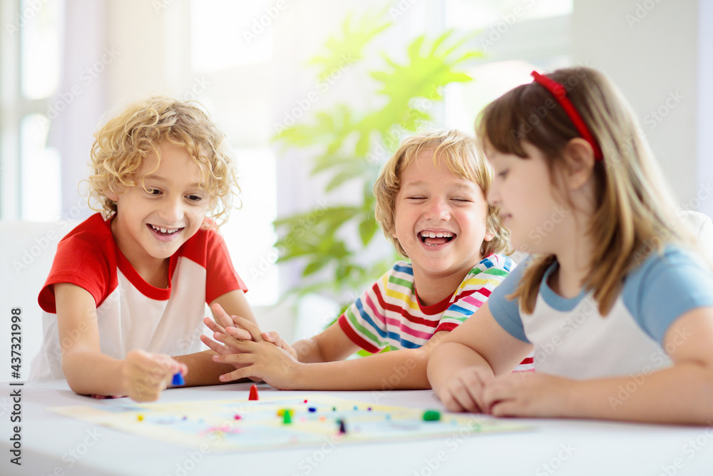 Family playing board game. Kids play. Stock Photo | Adobe Stock