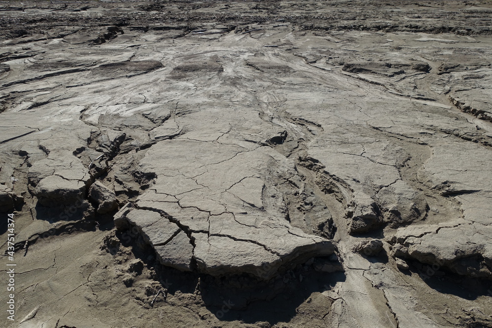 Stockfotot Water-washed land. Cracked crumbling clay and sandy soil ...