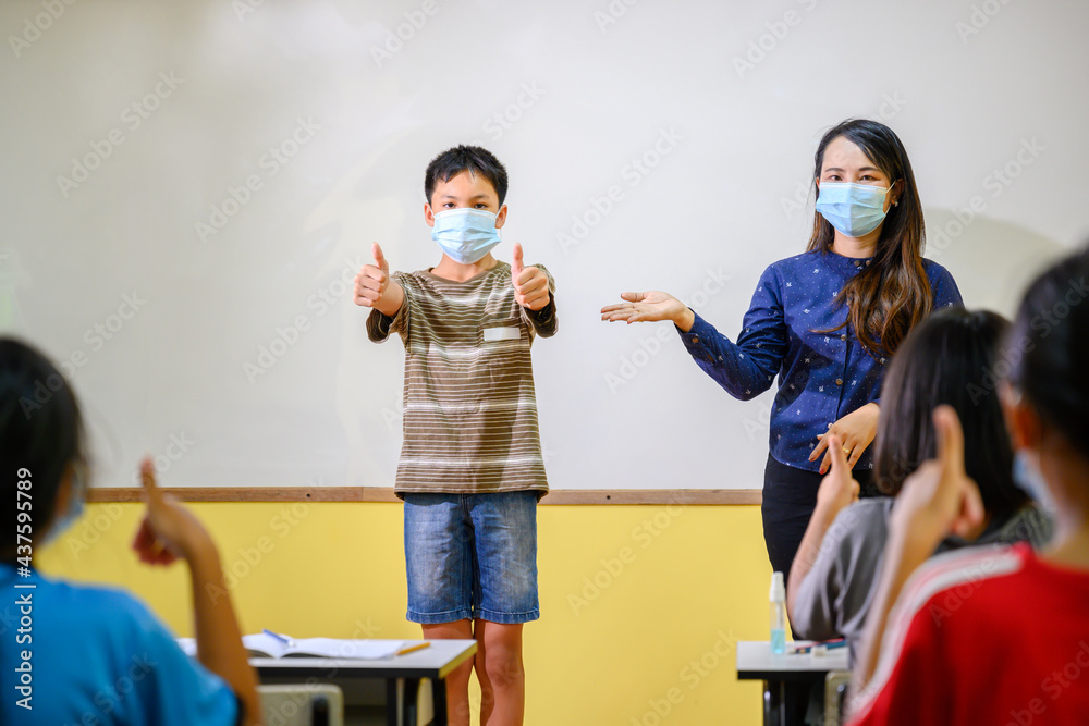 Asian female teacher and student Wear a mask to prevent coronavirus ...