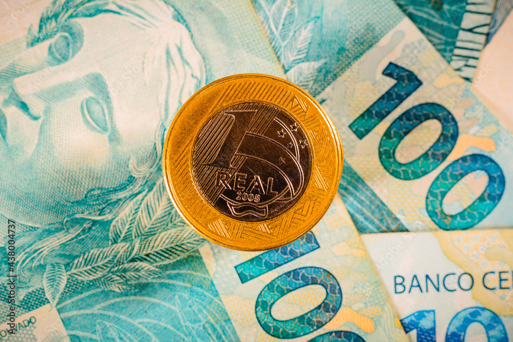 In this illustration photo the one real coin is placed on top of the ...