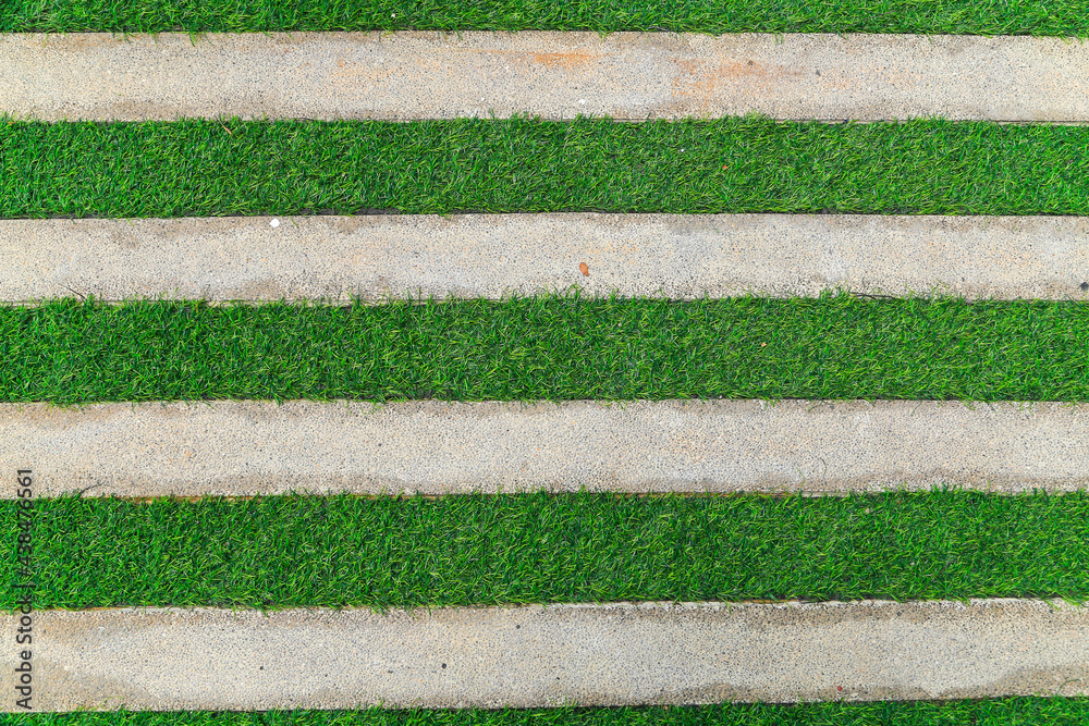 The garden paths are designed in parallel lines that combine artificial ...