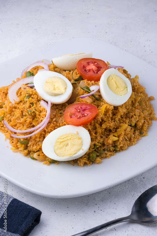rice noodle dish, also known as string hoppers biryani with boiled eggs ...