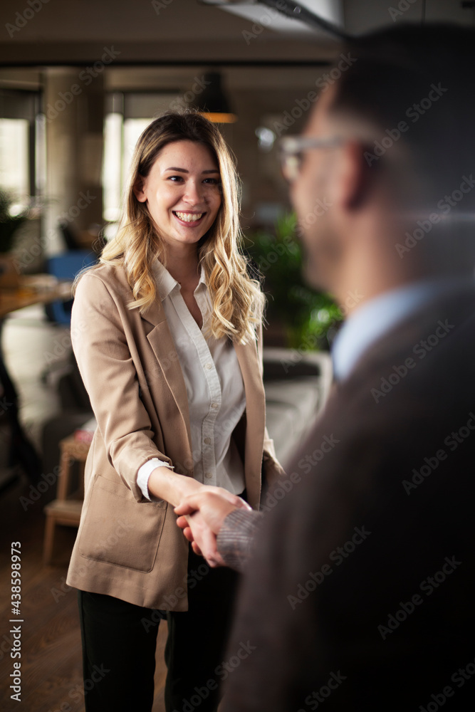 Businesswoman offering hand for handshake. Businessman and ...