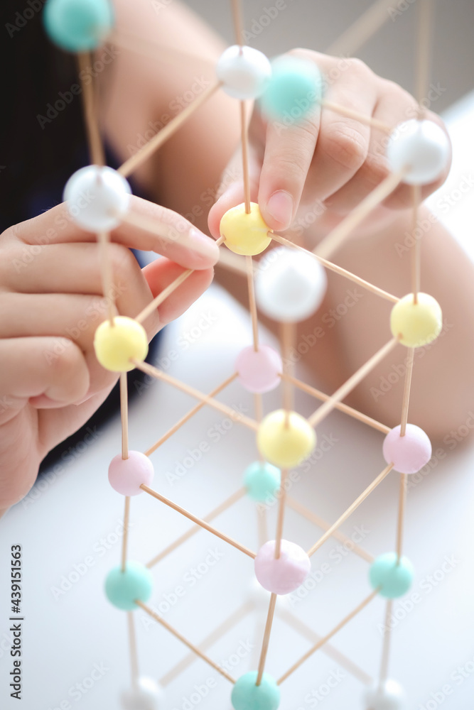STEM education, Close up hands, child learning making 3D geometric ...