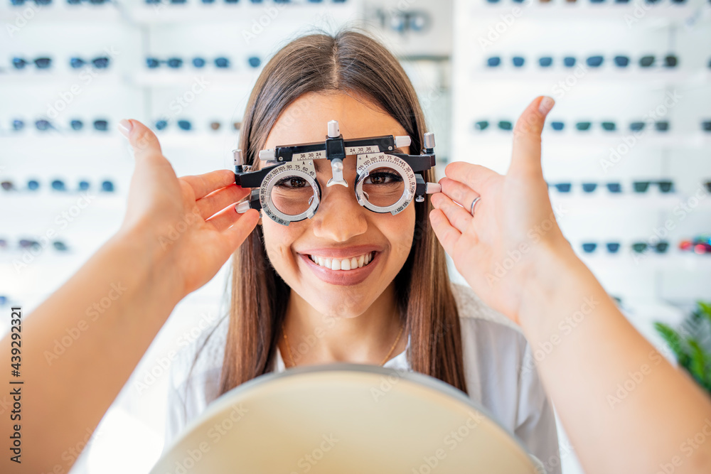 Female patient checking vision in ophthalmological clinic. Medicine ...