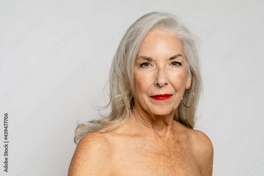 Mature Woman Poses With Bare Shoulders Stock Photo | Adobe Stock
