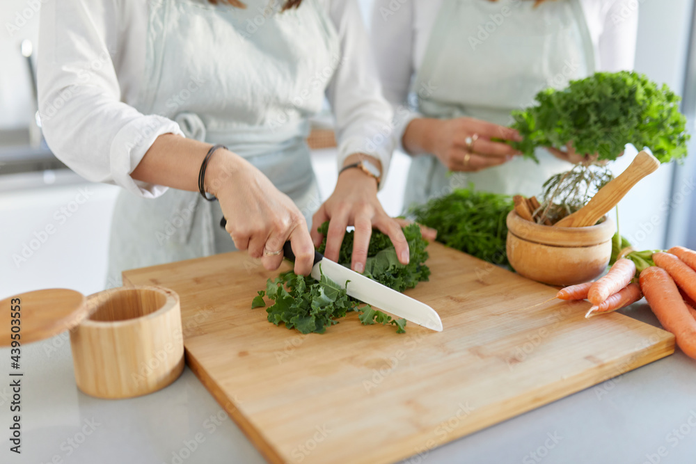 two sisters cooking healthy food Stock Photo | Adobe Stock