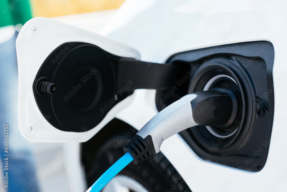 Plug inside electric car socket Stock Photo | Adobe Stock