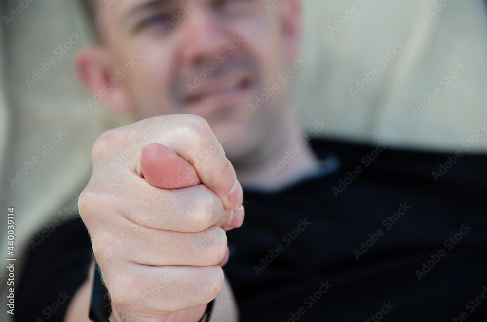Photo Stock Close-up hand showing fig sign against the background of ...