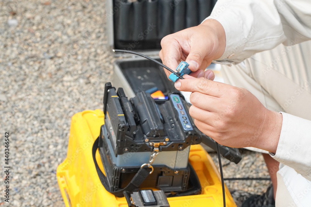 Communication system technician checks the data line connection Cable ...