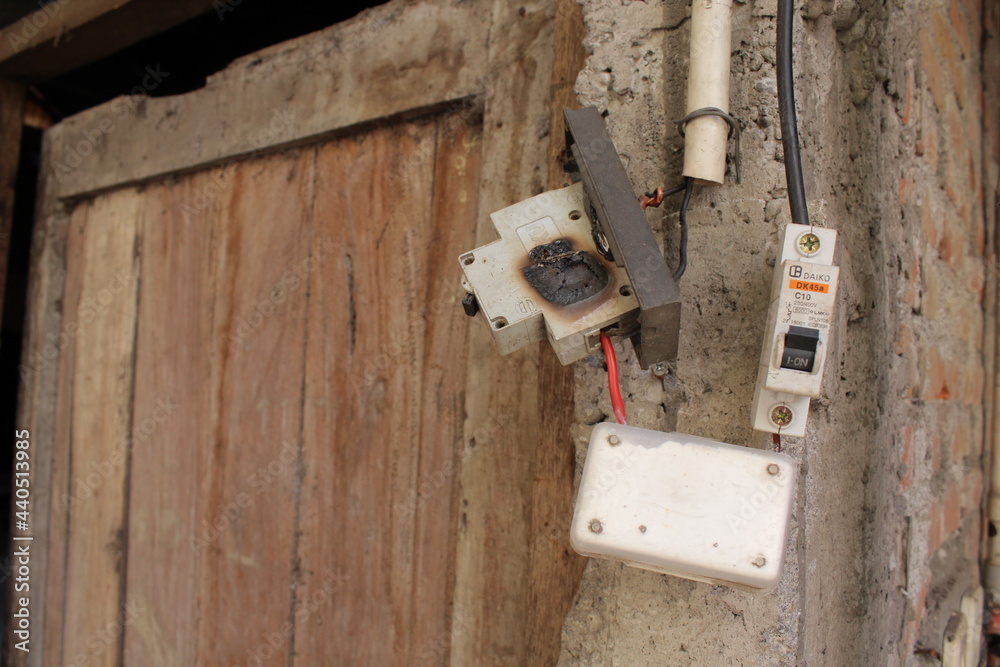Old house with bad installation of the switchboard and scorched's. High ...
