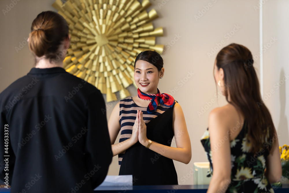 beautiful young asian woman receptionists working at a reception desk ...