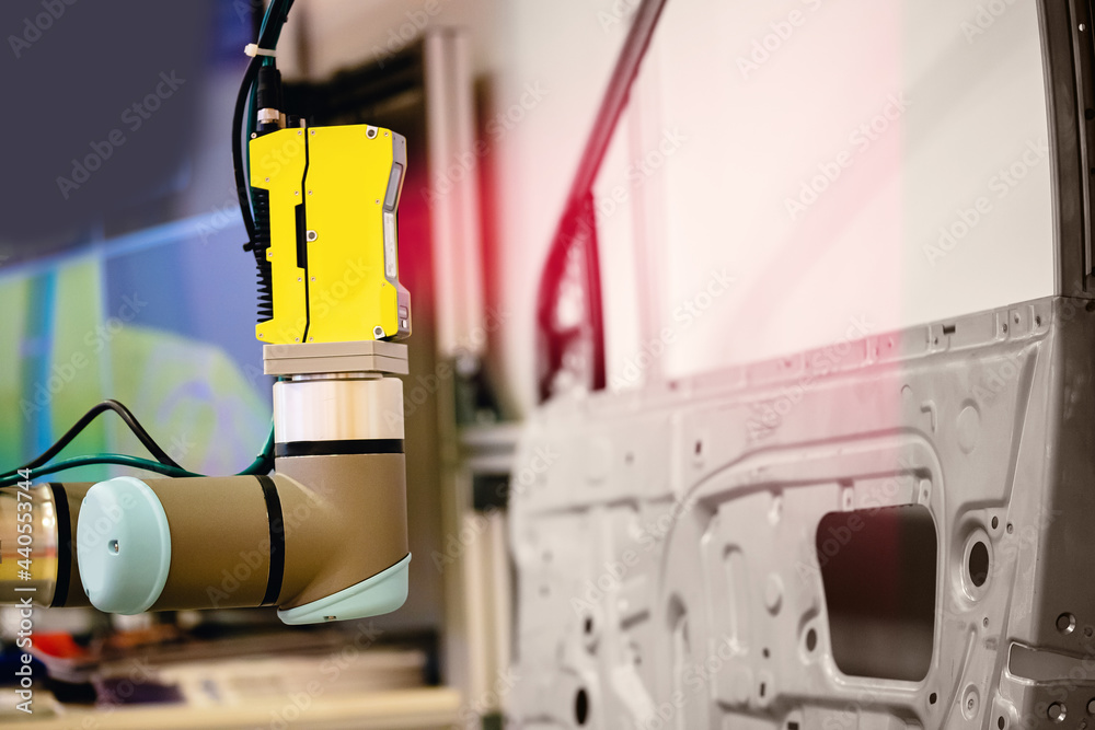 Robot arm performs 3D scan of manufactured part of machine for quality ...
