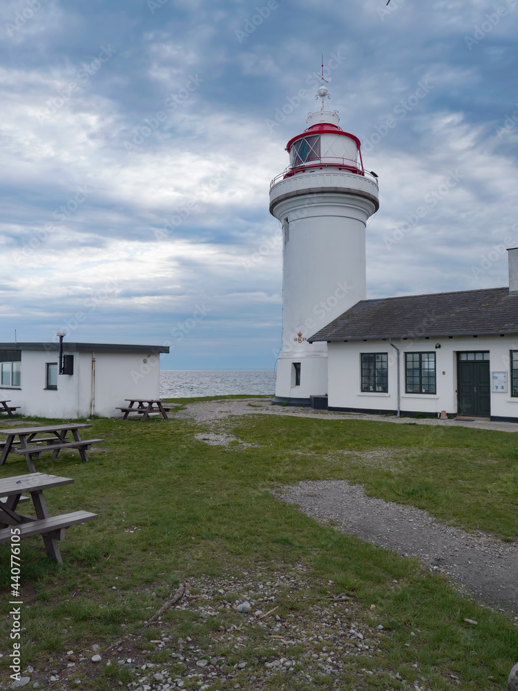 Lighthouse and clouded sky. The Lighthouse - Sletterhage fyr was built ...