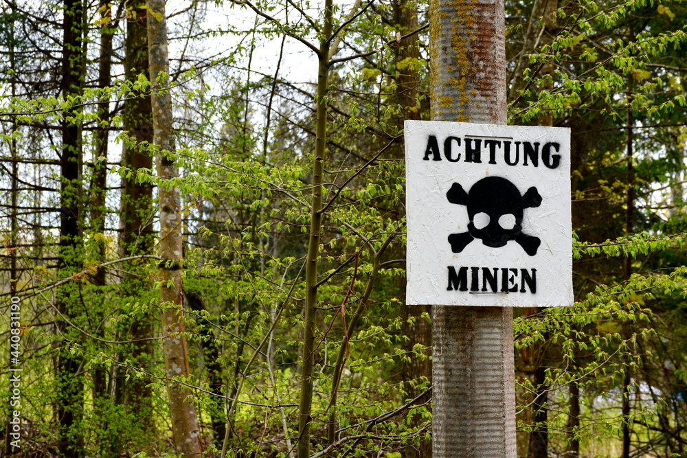 Stock-Foto „An old abandoned sign saying ACHTUNG MINEN (CAUTION! MINES ...