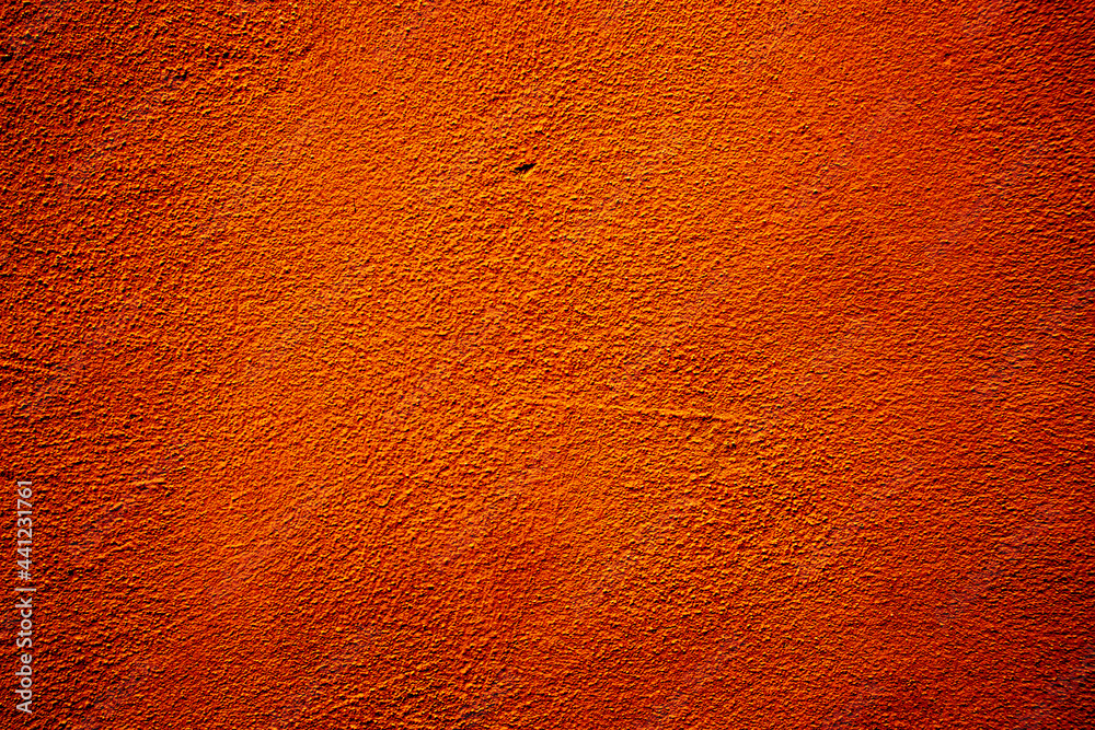 Orange colored abstract wall background with textures of different ...