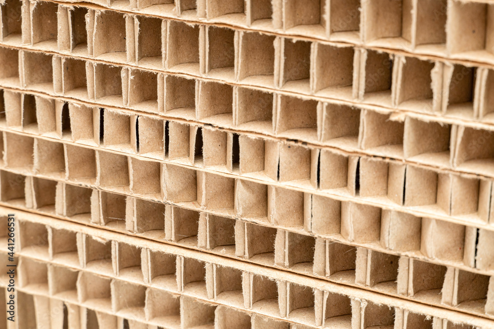 cut of honeycomb cardboard pack stack with large cells close-up as a ...