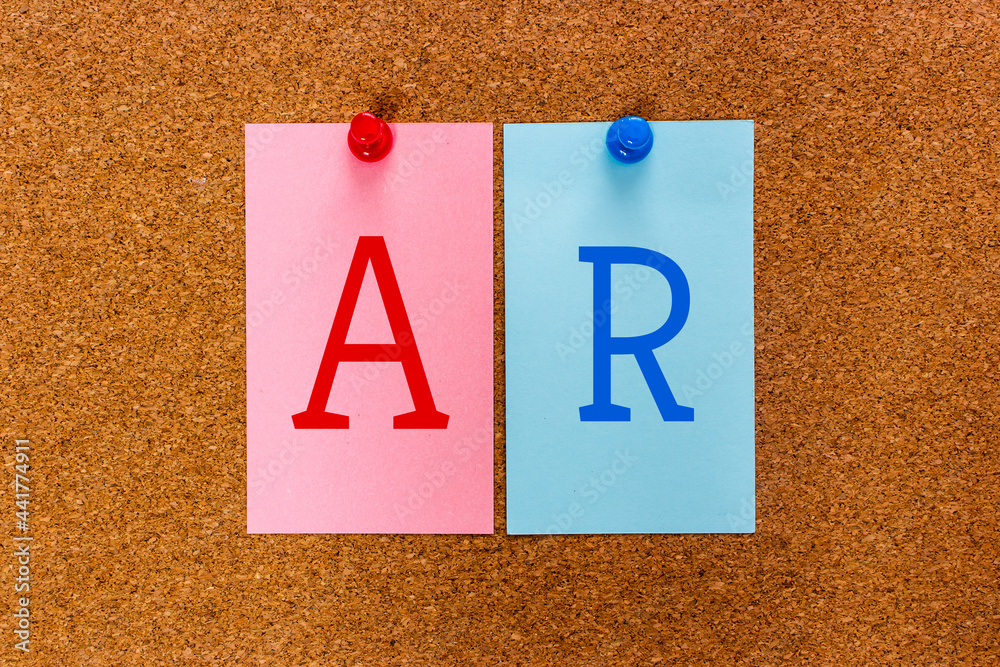 Conceptual 2 letter abbreviation AR on multicolored stickers attached ...